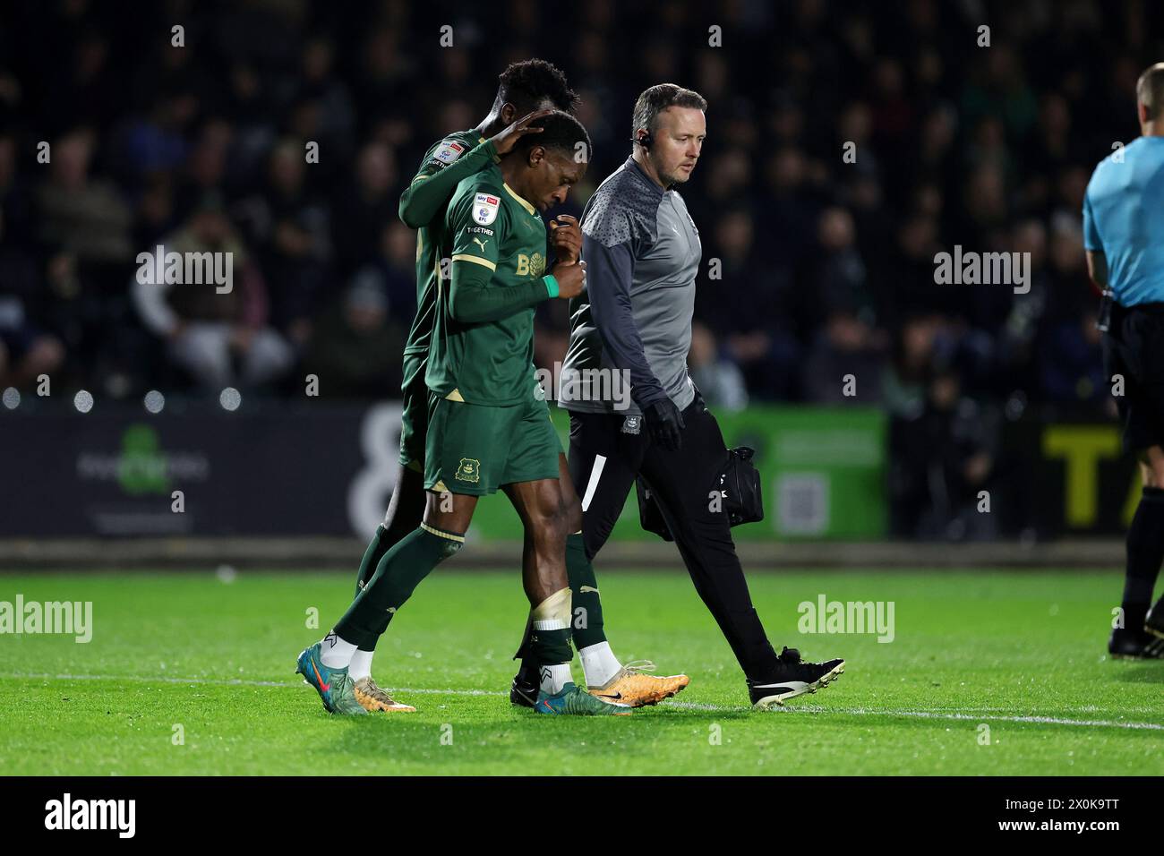 Plymouth Argyle's Mickel Miller leaves the pitch following an injury ...