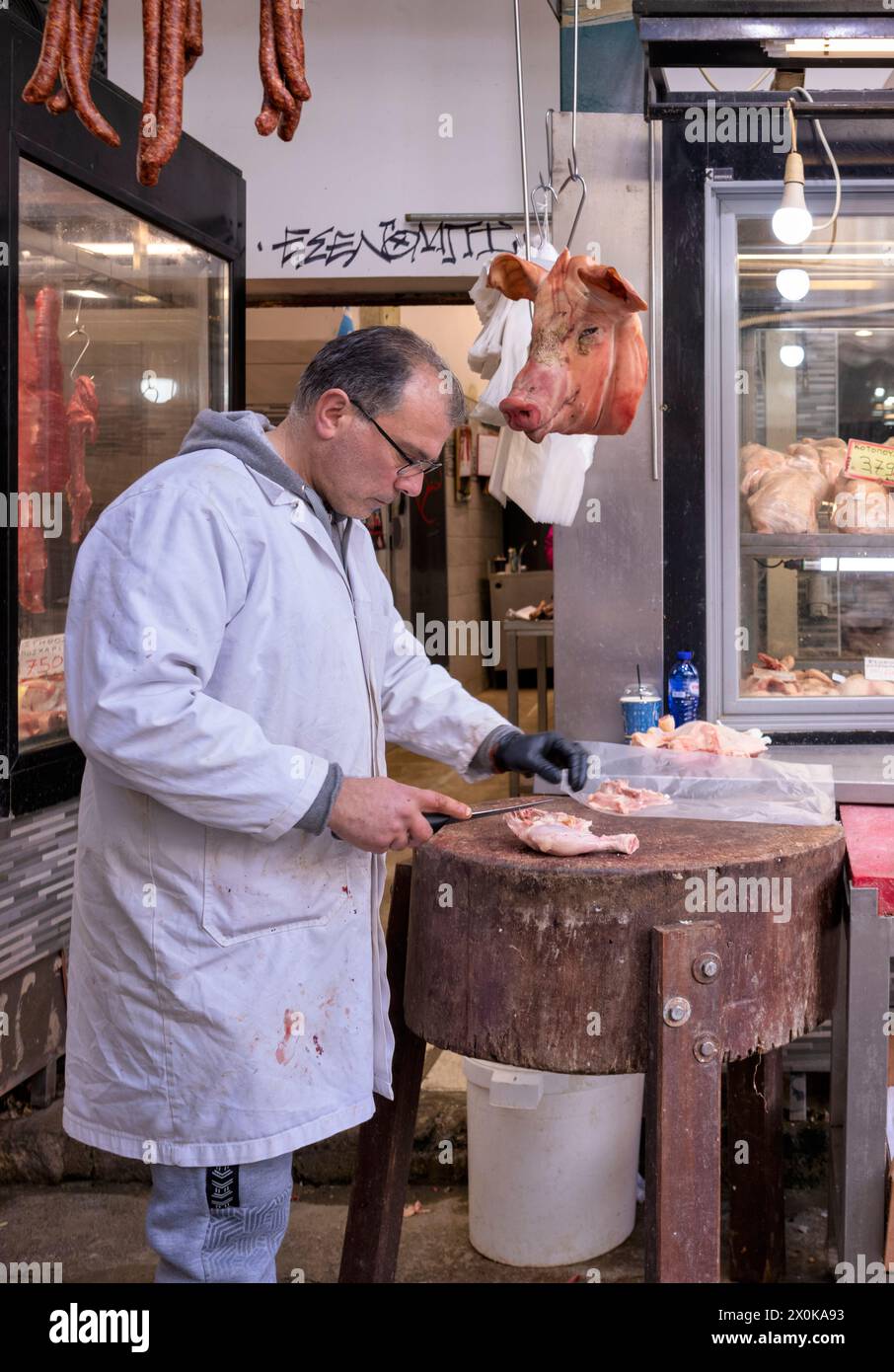 Butcher, meat trader posing proudly in front of his market stall ...