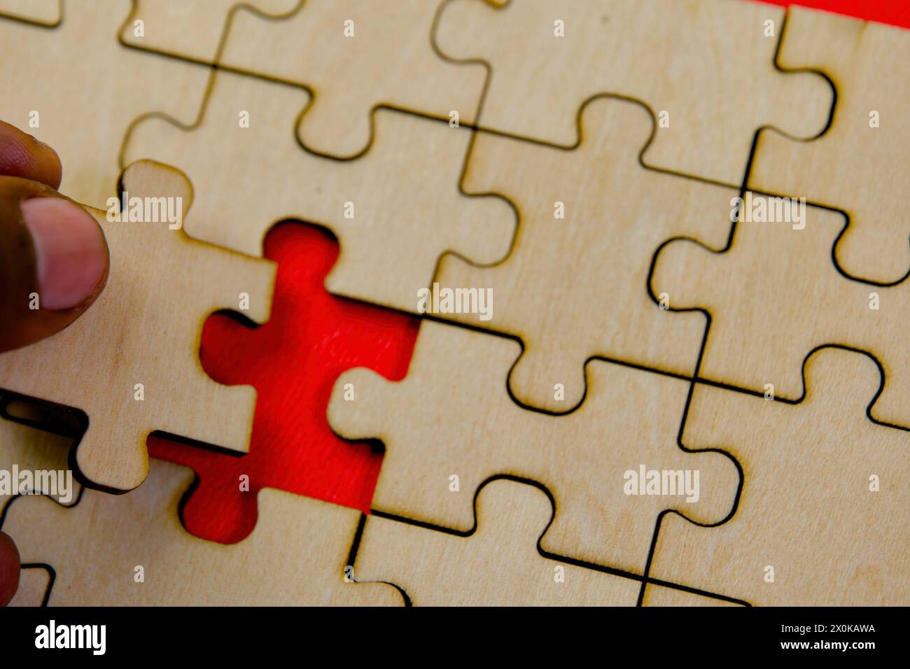 A close-up photo of a nearly finished jigsaw puzzle, with only one ...