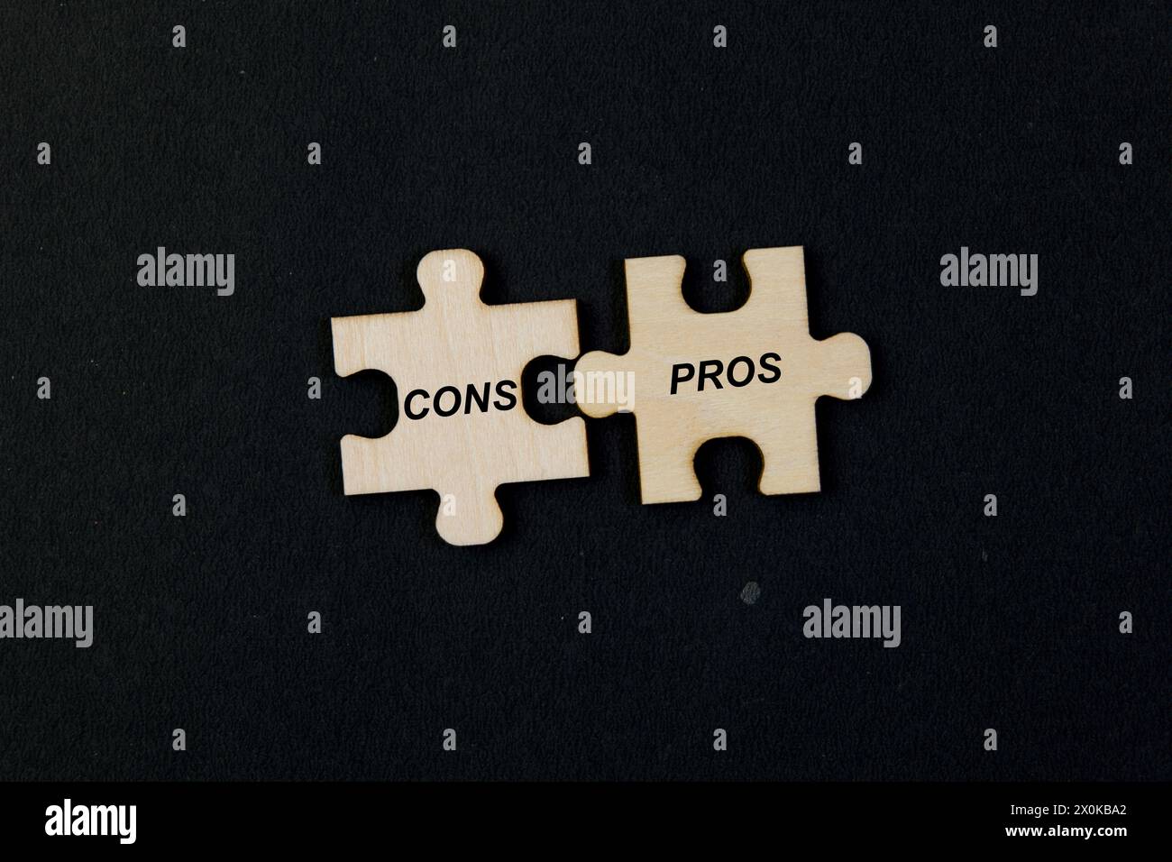 Jigsaw puzzle pieces coming together to form the words PROS and CONS ...