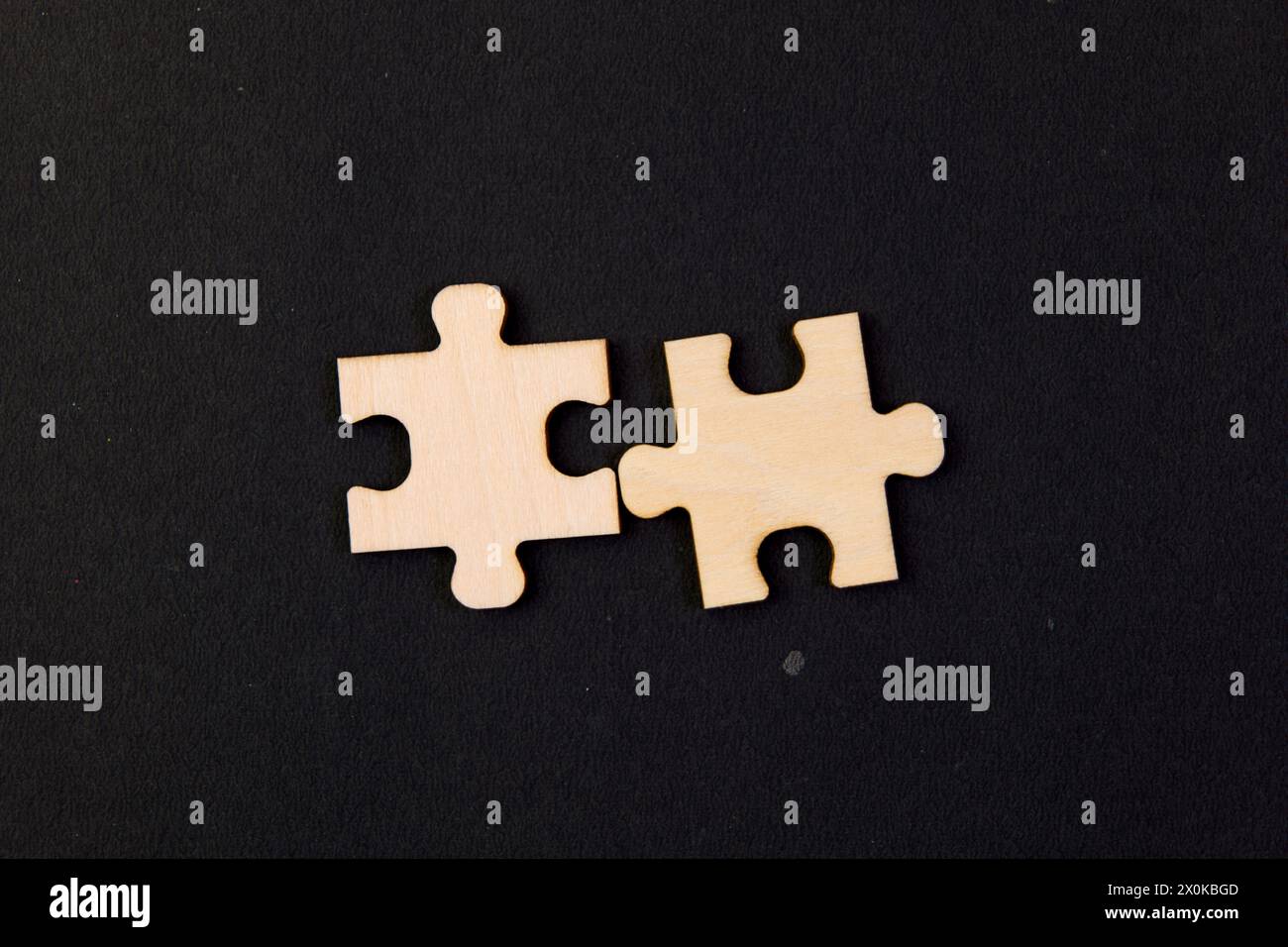 This image depicts two interlocking jigsaw puzzle pieces coming ...