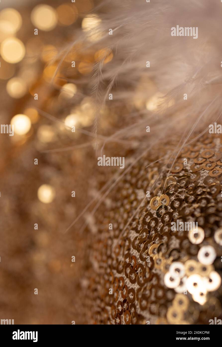 Vertical picture of gold glitter fabric with metallic shimmers and ...
