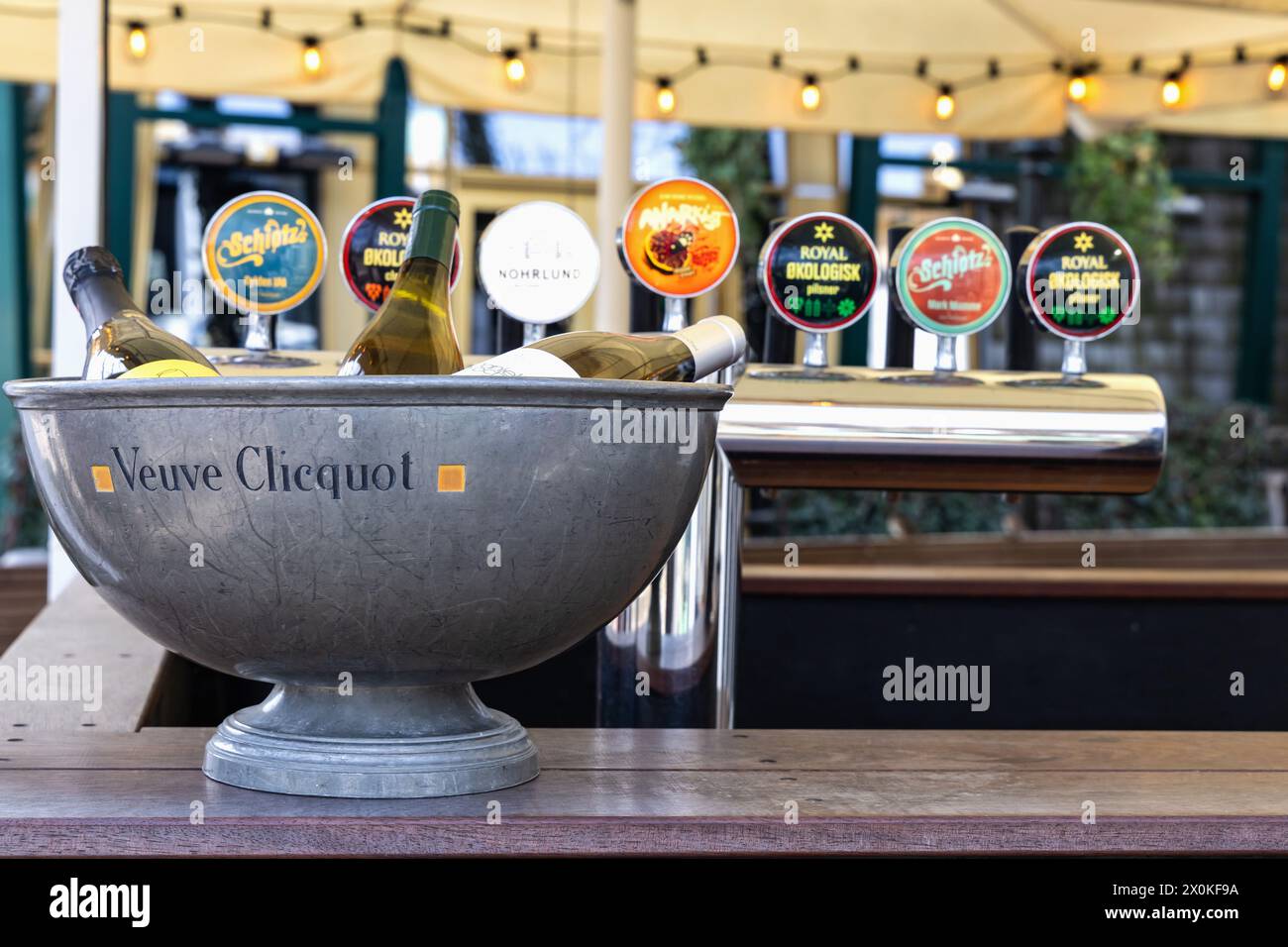 Street outside bar with drinks and bottles of Veuve Clicquot champagne ...