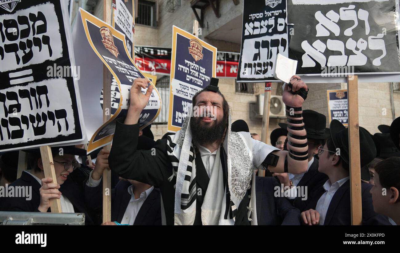 A Haredi Jew wrapped with Talit shawl and Tefillin, or phylacteries ...