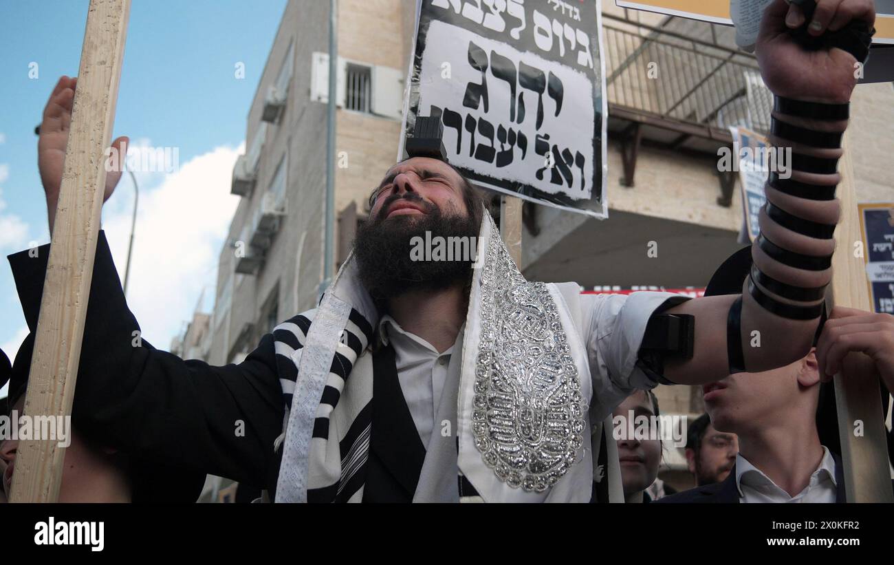 A Haredi Jew wrapped with Talit shawl and Tefillin, or phylacteries ...