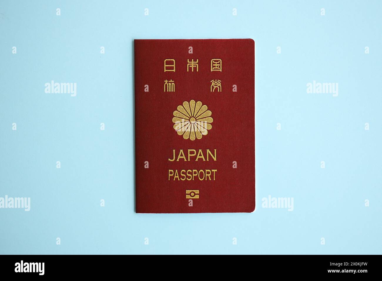 Japan passport on blue background close up. Tourism and citizenship ...