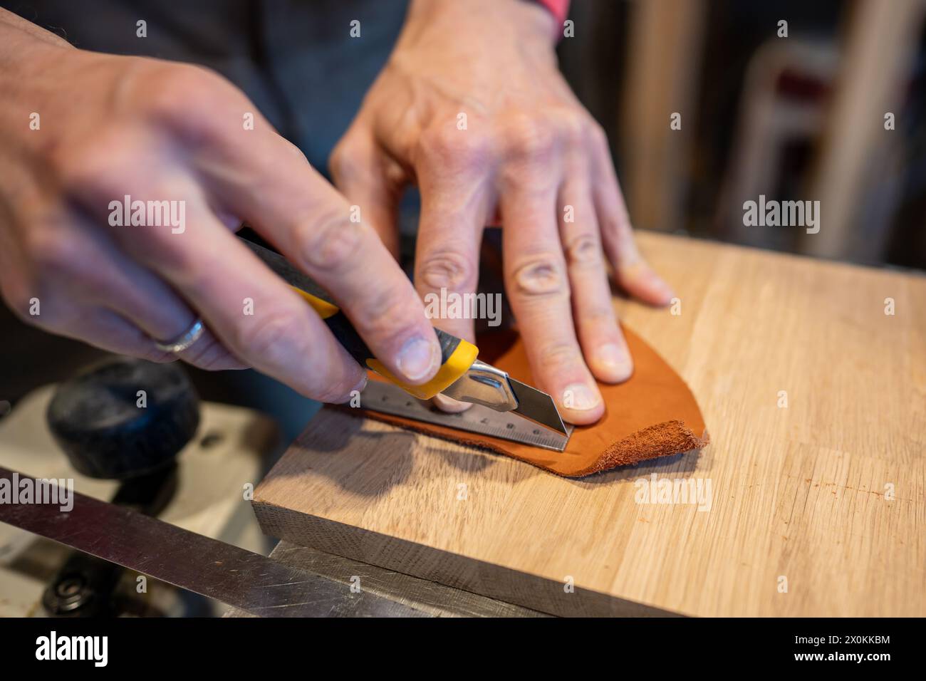 Male hands cutting leather skin. Master shoemaker cobbler professional ...