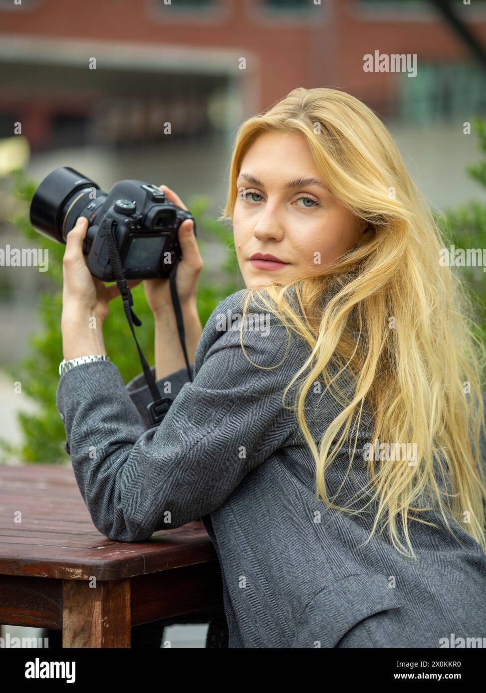 Young woman with a camera in hamburg hi-res stock photography and ...