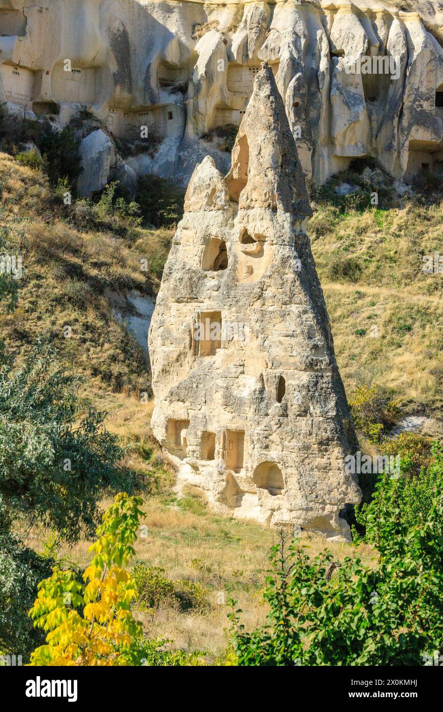 Ancient cave dwellings carved into limestone rocks. Fairy chimney in ...