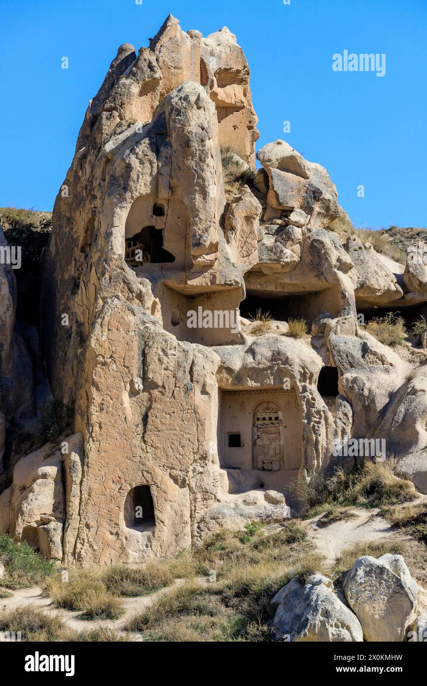 Ancient cave dwellings carved into limestone rocks. Fairy chimney in ...