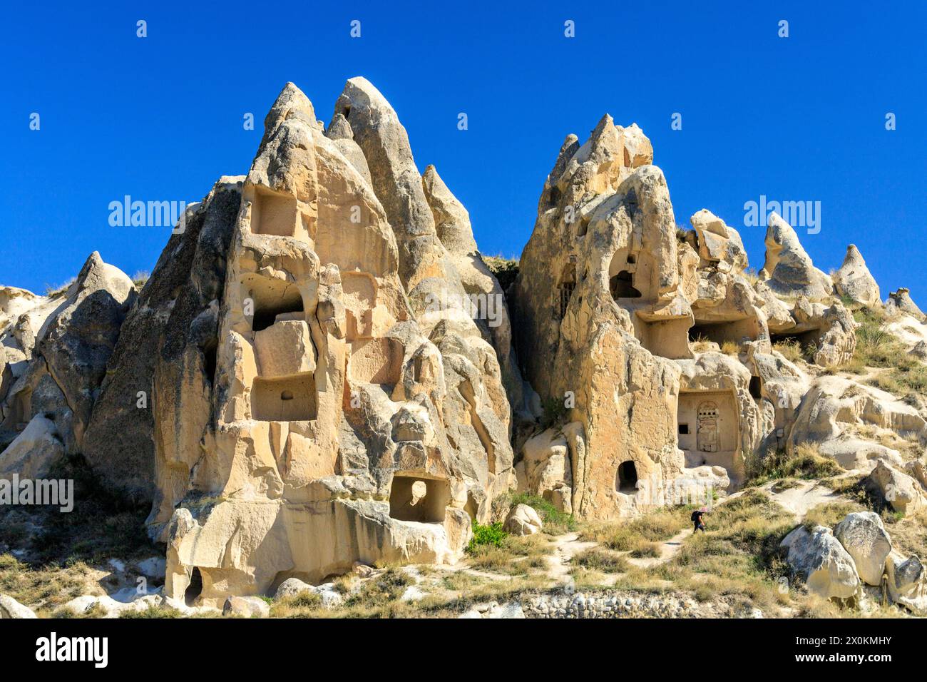 Ancient cave dwellings carved into limestone rocks. Fairy chimney in ...