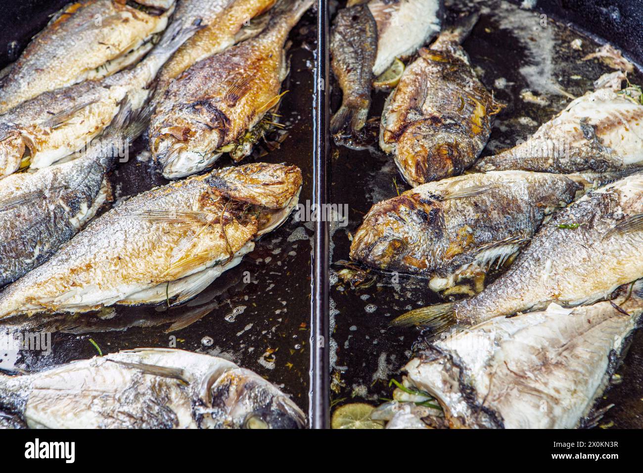 Sea bream in the frying pan Stock Photo - Alamy