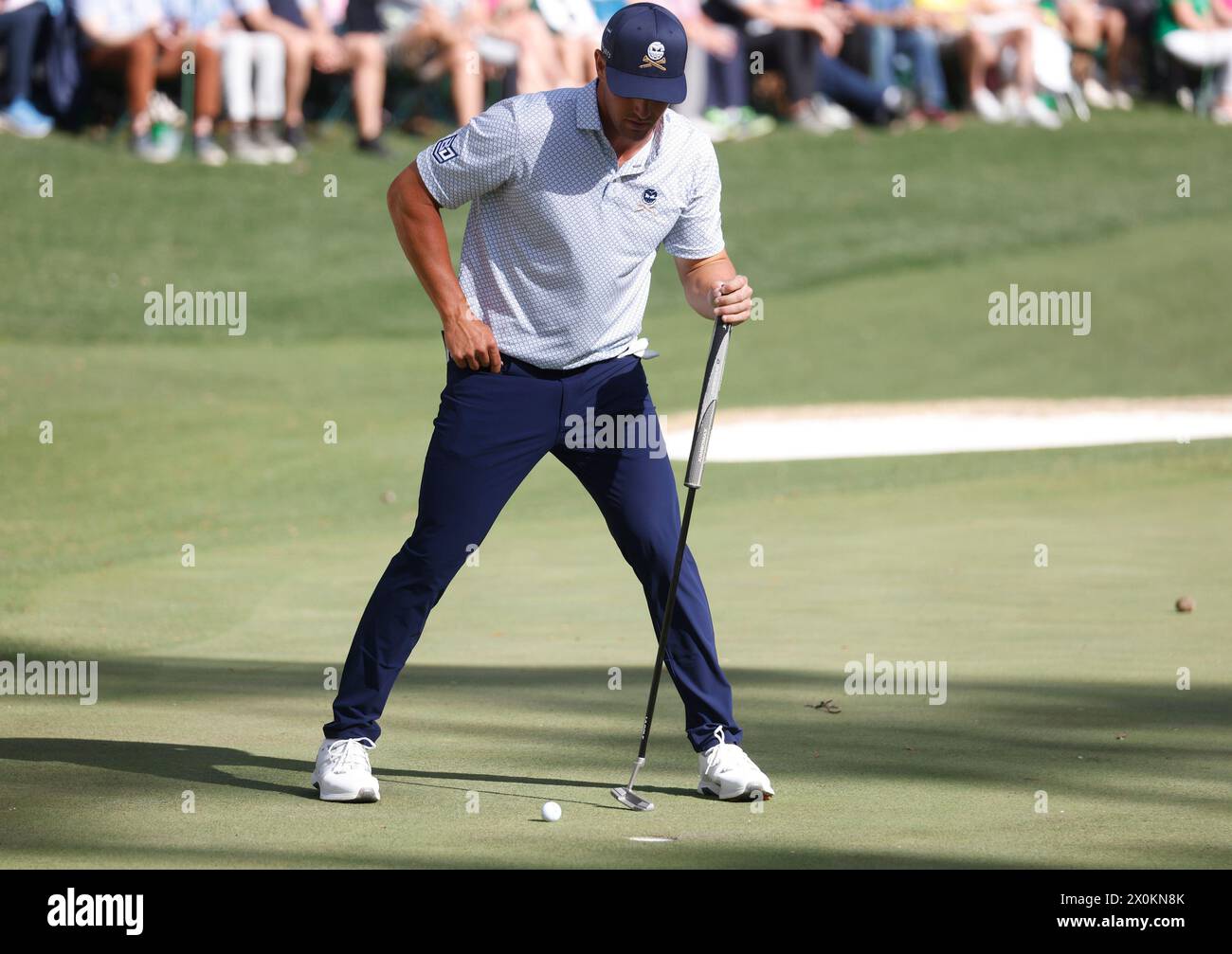 Augusta, United States. 12th Apr, 2024. Bryson DeChambeau prepares to ...