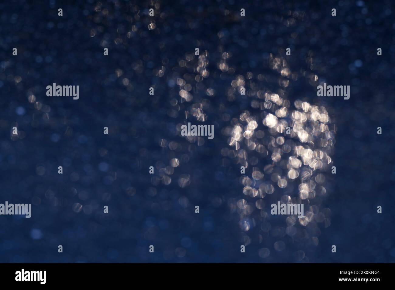 circular light reflections caused by sunlight on a layer of ice ...