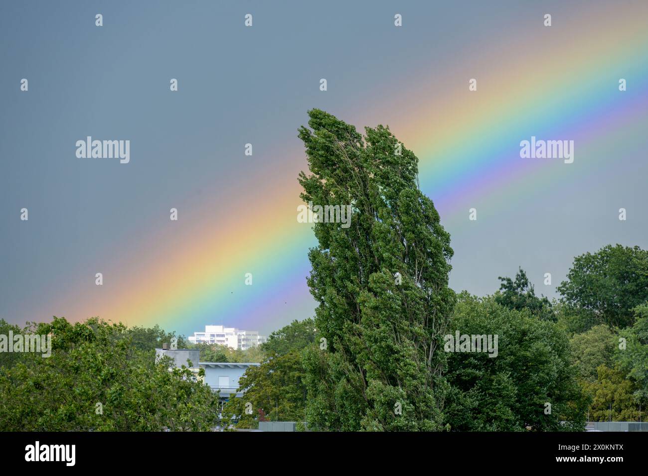 Rainbow in stormy weather Stock Photo - Alamy