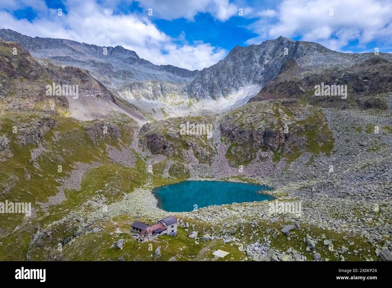 View of the Franco Tonolini refuge and Lake Rotondo in the beautiful ...