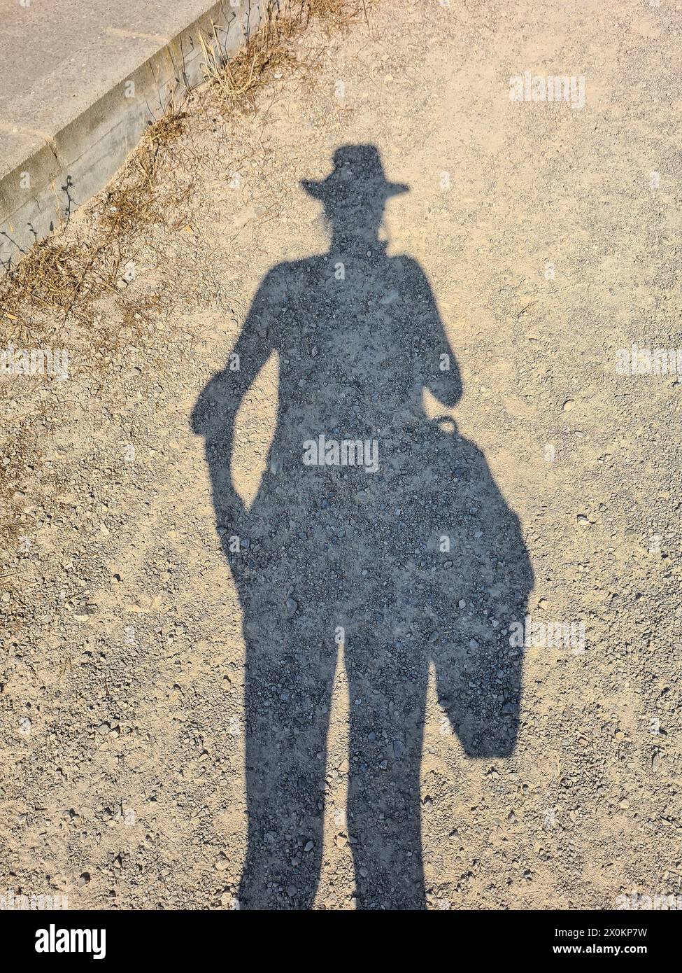 Shadow of a woman with a hat on the street, summer vacation in Mallorca ...