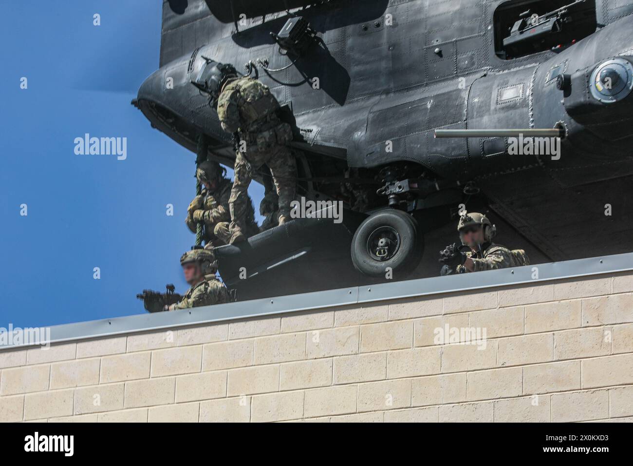 U.S. Army Rangers fast-roped out of an MH-47 Chinook helicopter and ...