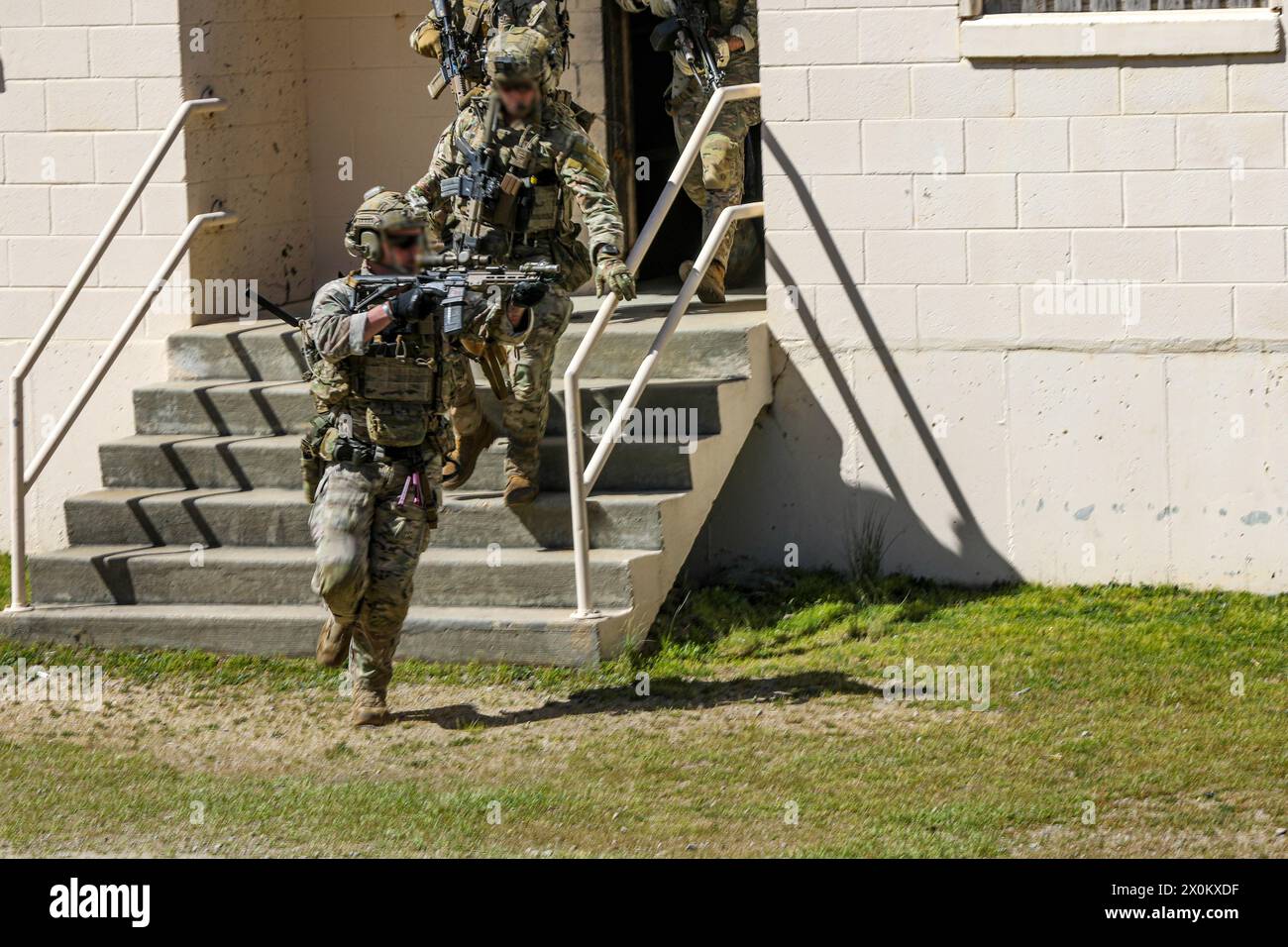 U.S. Army Rangers move to assault and clear a building during the U.S ...