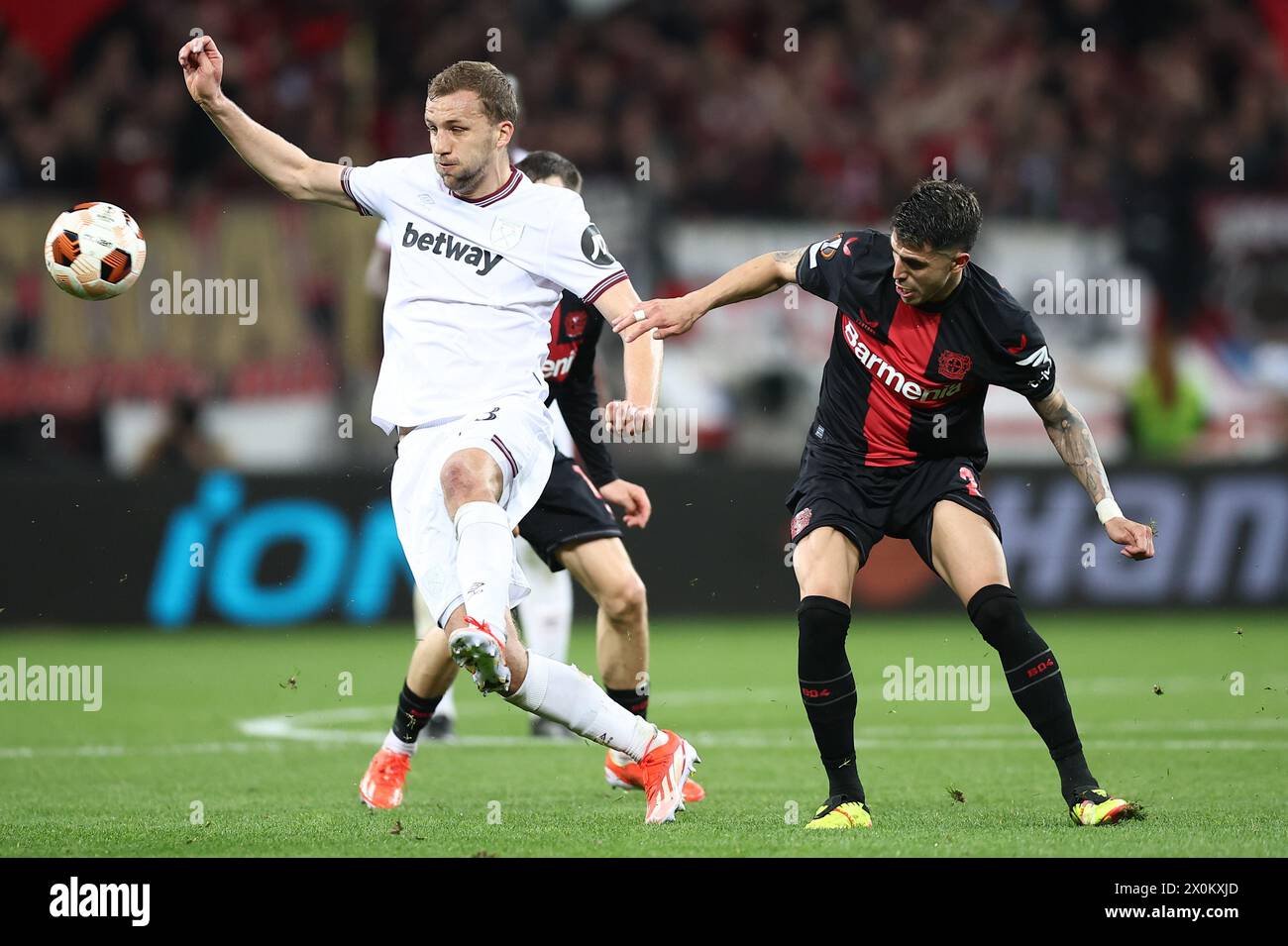 Leverkusen, Germany. 11th Apr, 2024. Tomas Soucek of West Ham United and Exequiel Palacios of ...