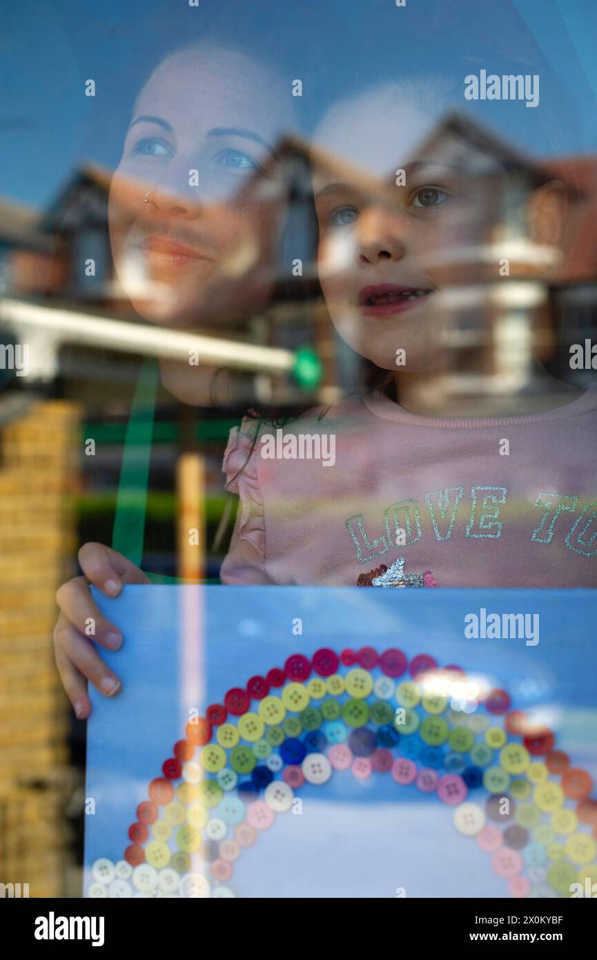 Lockdown 202o window portraits Stock Photo - Alamy