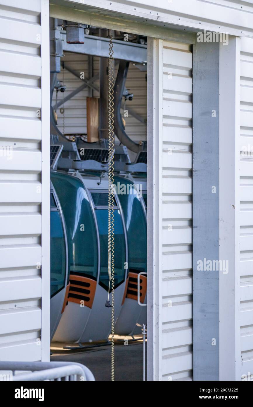 View of gondola lift cabins stored inside a large industrial building ...
