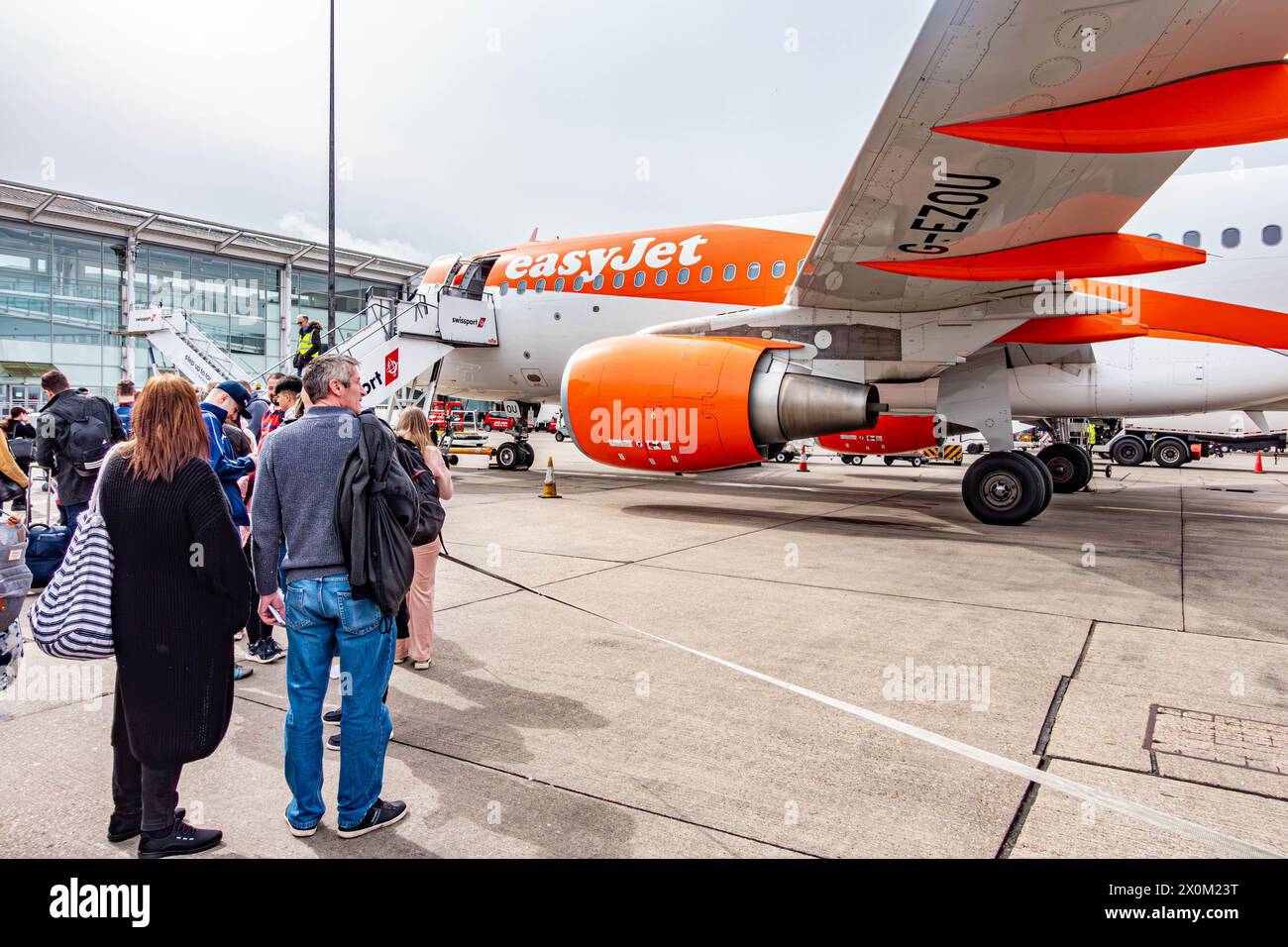Passengers boarding an EasyJet aircraft at Birmingham International ...
