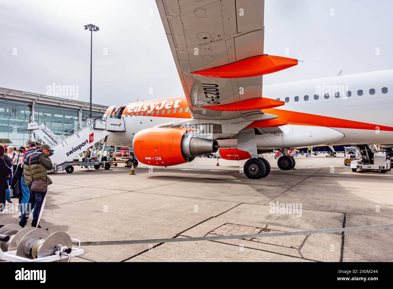 Passengers boarding an EasyJet aircraft via steps from the tarmac at ...