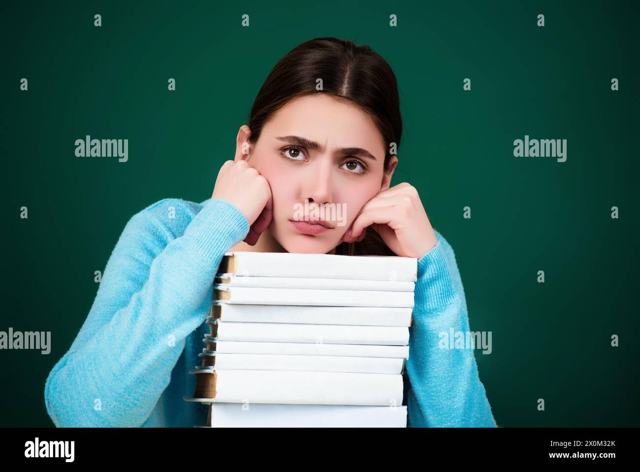 Sad college student. Tired school girl. Tired student having too much ... Sad college student. Tired school girl. Tired student having too much ...