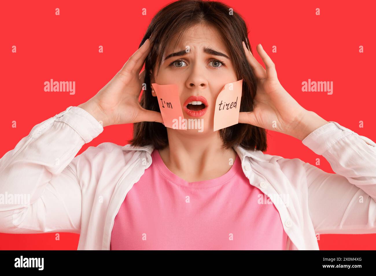 Beautiful young stressed woman and sticky notes with text I'M TIRED on ...