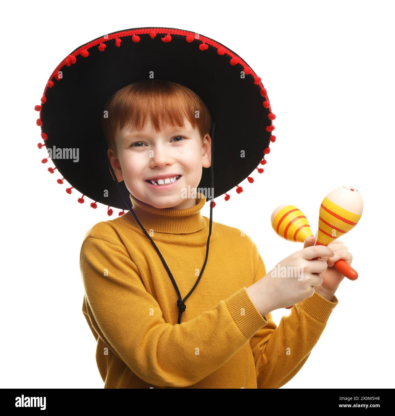 Cute boy in Mexican sombrero hat with maracas on white background Stock ...
