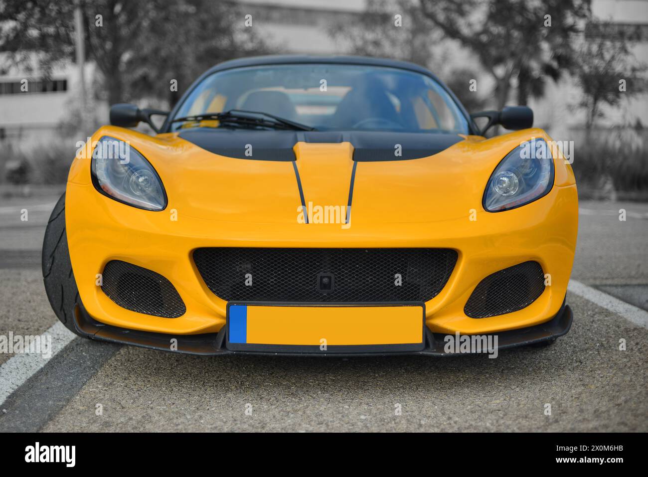 A frontal photo of a British yellow roadster Stock Photo - Alamy