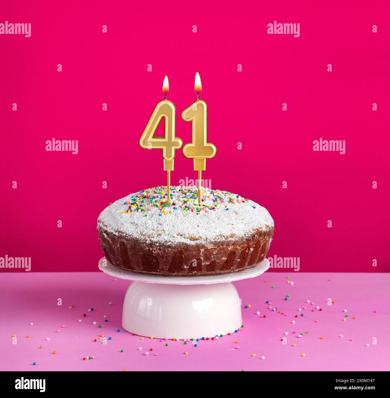 Birthday cake with number 41 candle on pink background Stock Photo - Alamy
