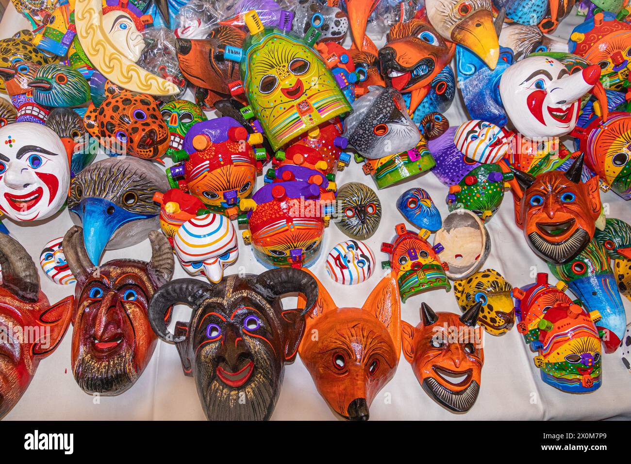 Souvenir colorful wooden and hand painted masks of various Ecuadorian ...