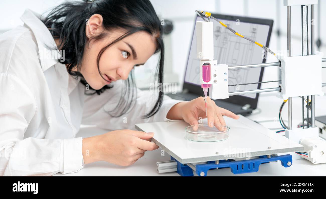 Scientists working with a 3D bioprinter Stock Photo - Alamy