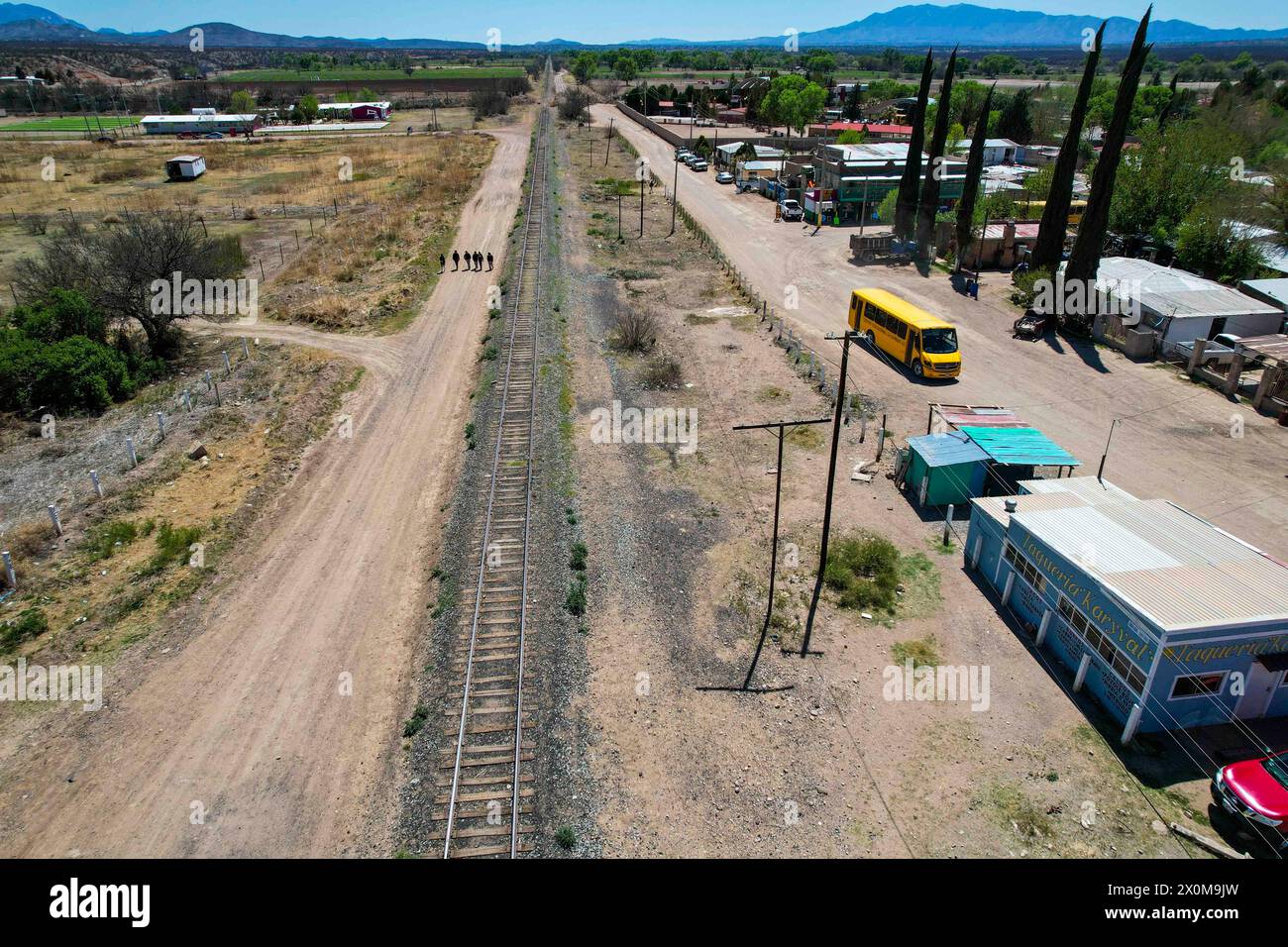 Aerial view of train tracks and old train station in the community of ...