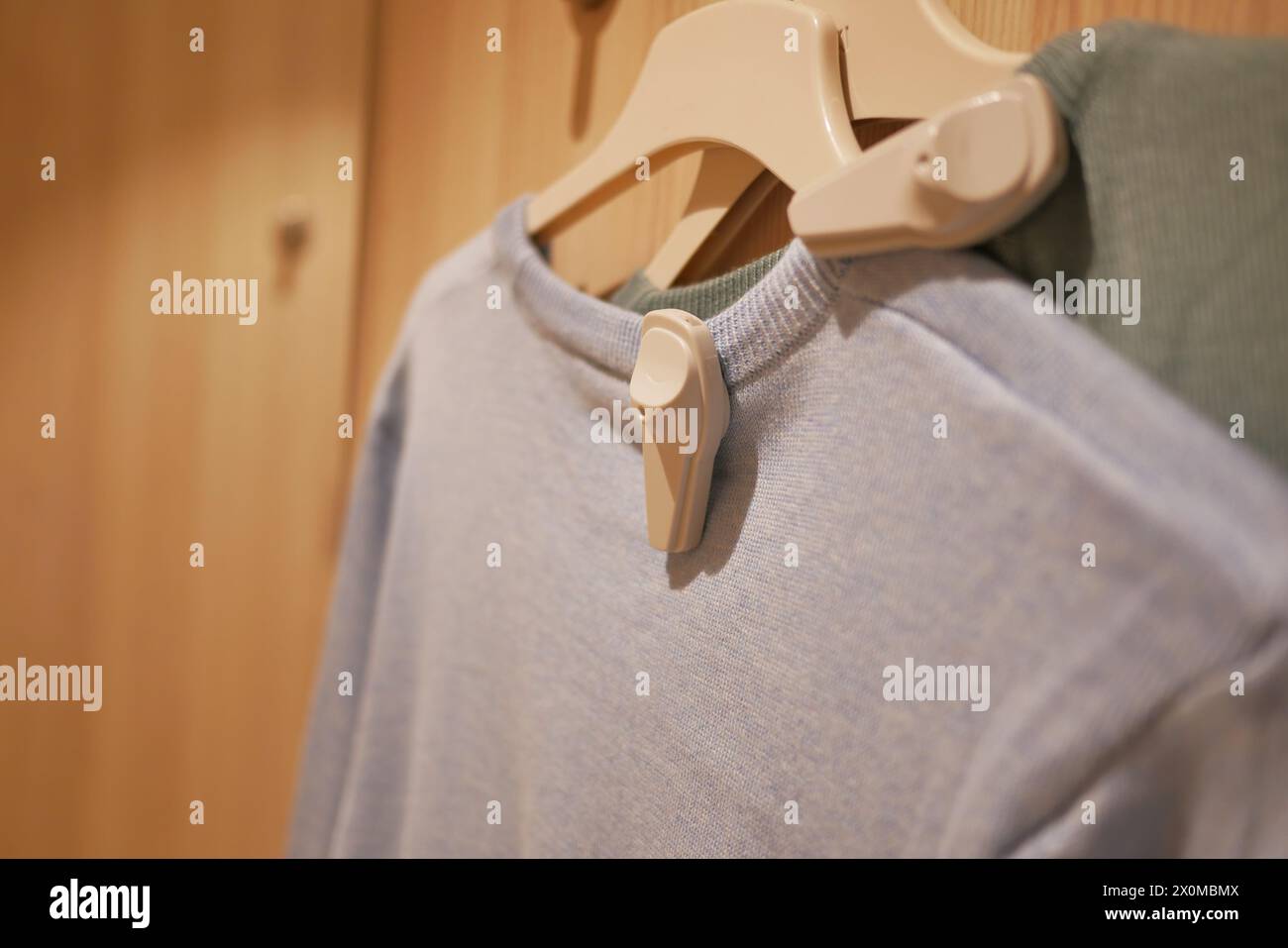 Security tags on clothes hi-res stock photography and images - Alamy