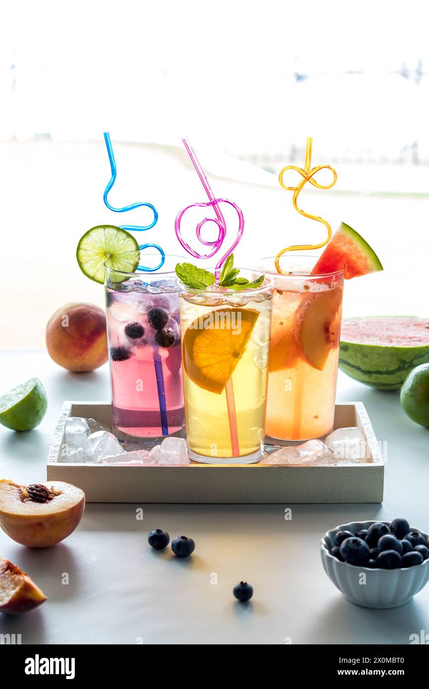 Refreshing fruit flavoured seltzer waters on a tray of ice with crazy ...