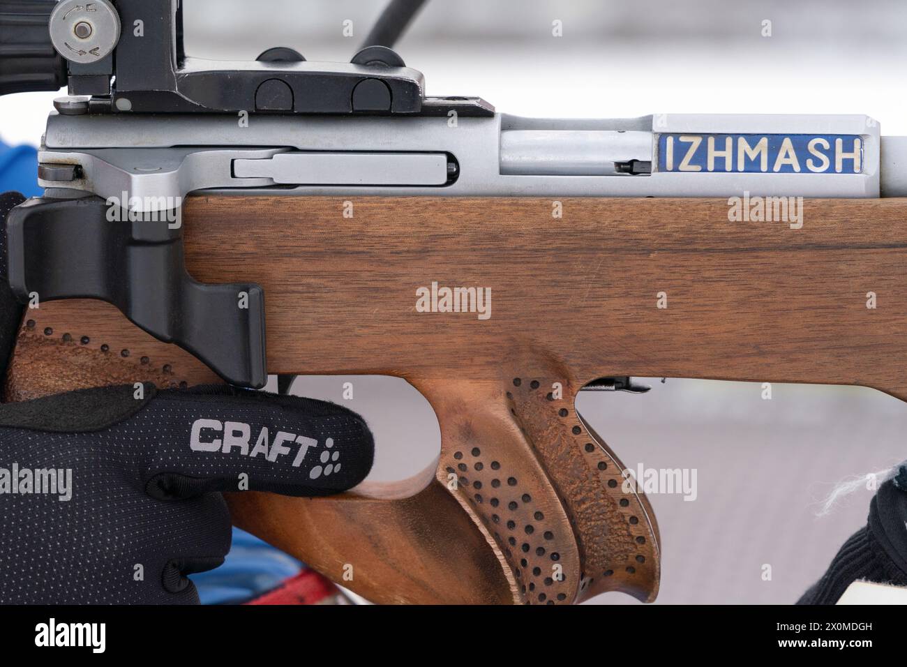 Sportsman biathlete aims rifle shooting. Selective focus, extreme close ...