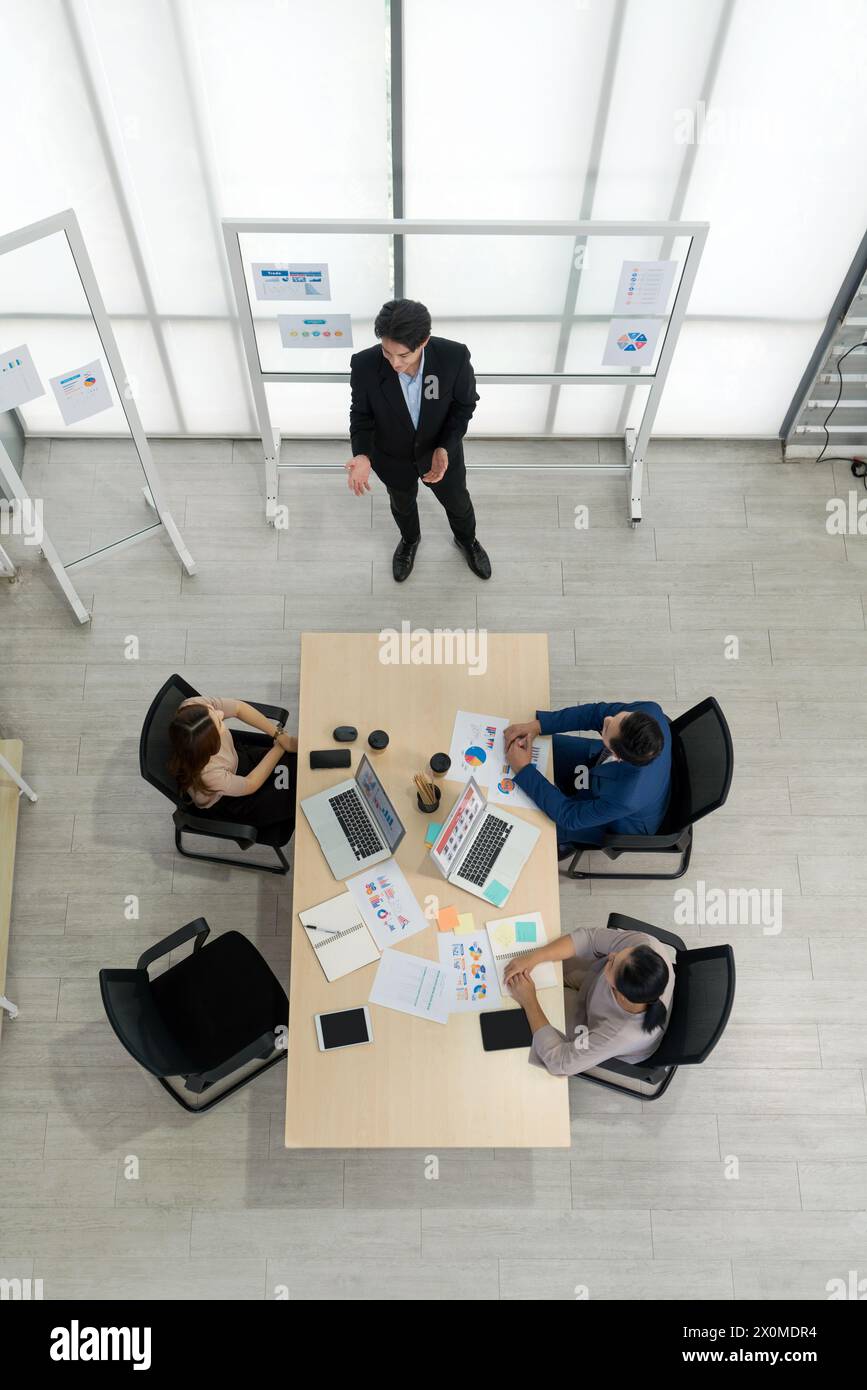 Gathered around table hi-res stock photography and images - Alamy