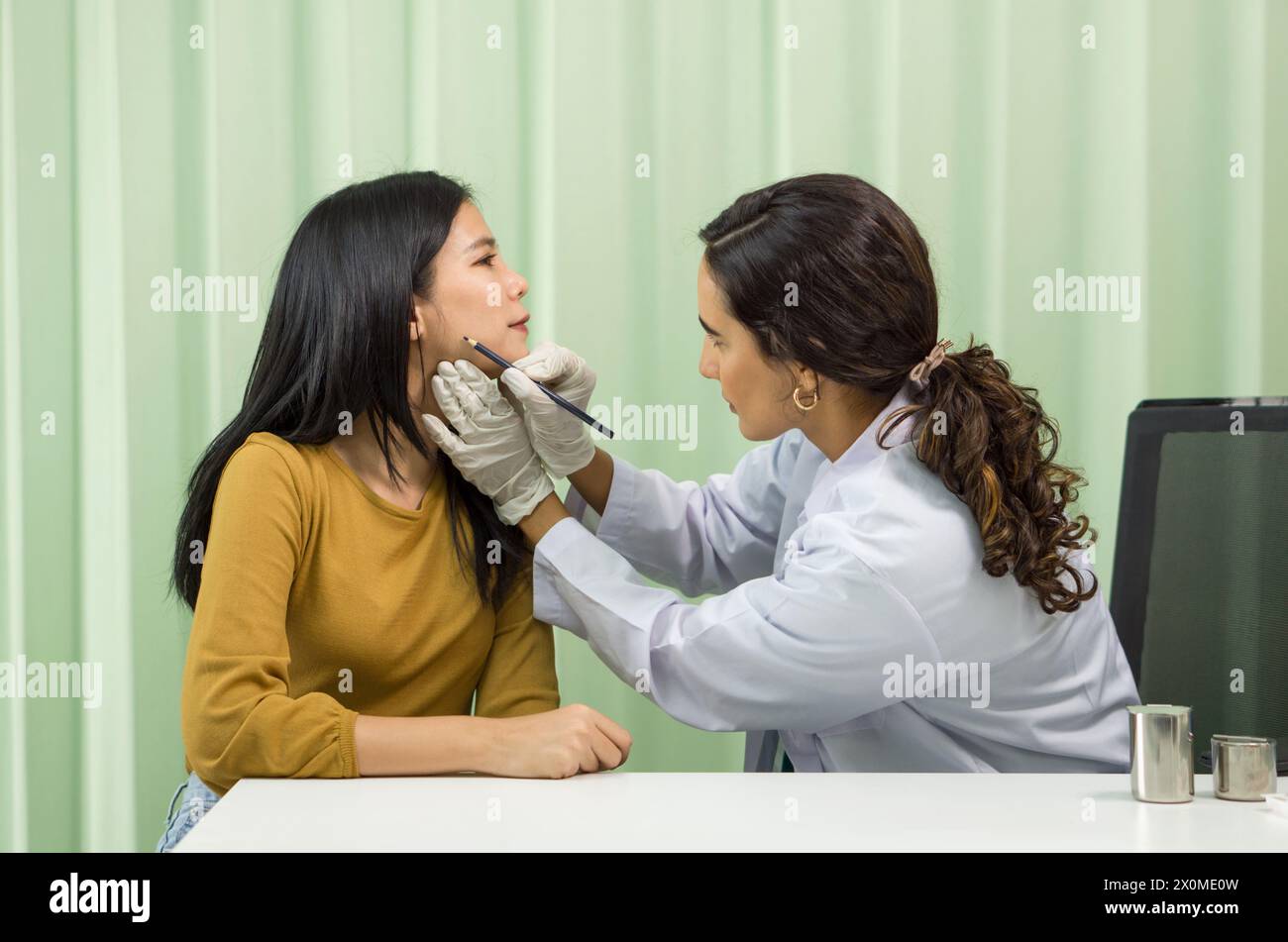A professional healthcare provider is precisely performing a chin ...