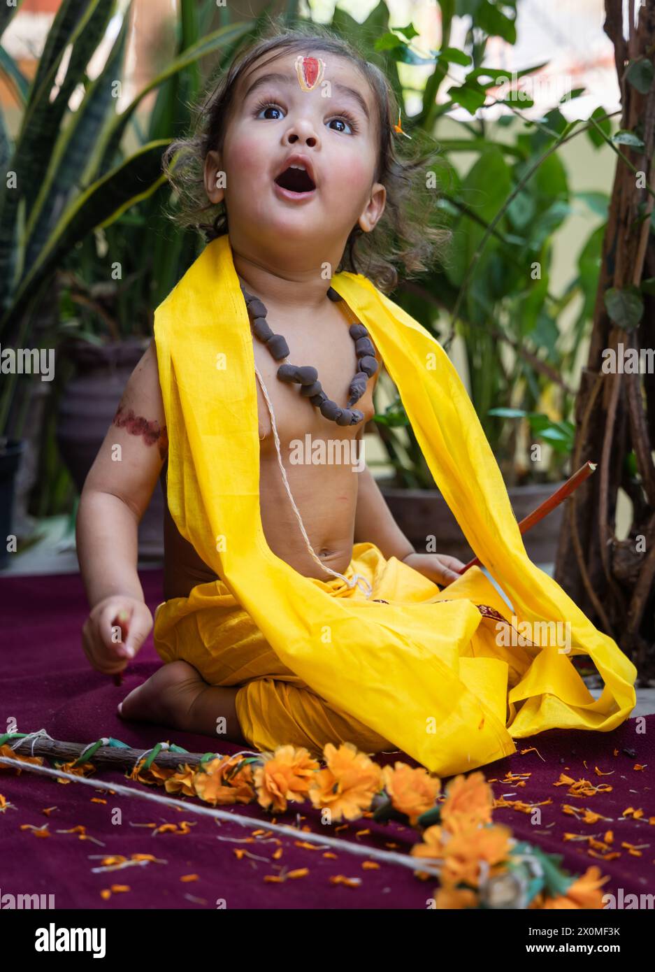 Portrait of cute Indian boy dresses as lord rama with bow at outdoor ...