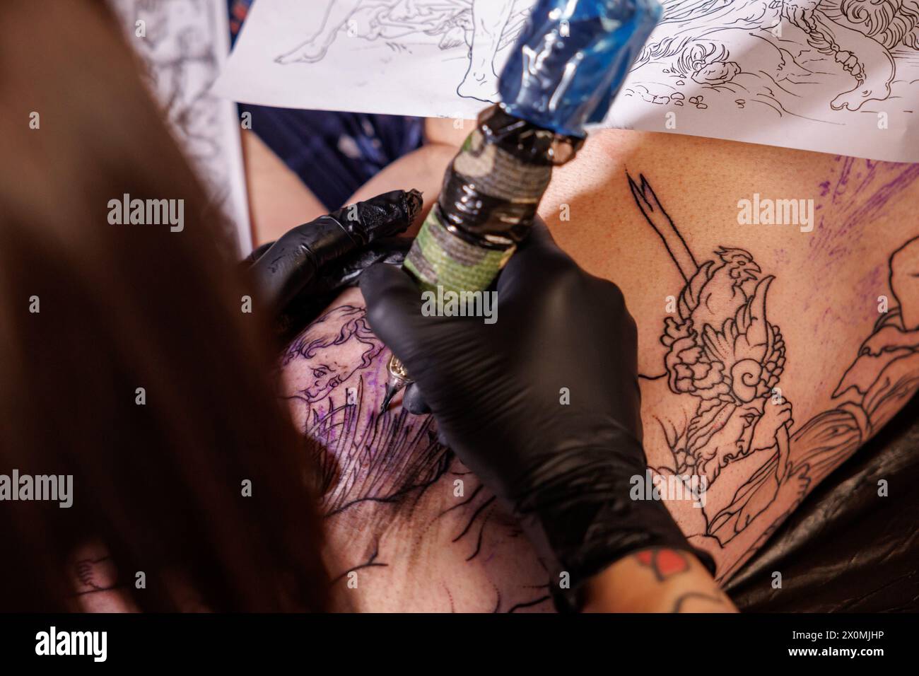 12 April 2024, Bavaria, Nuremberg: The French tattoo artist Maud ...