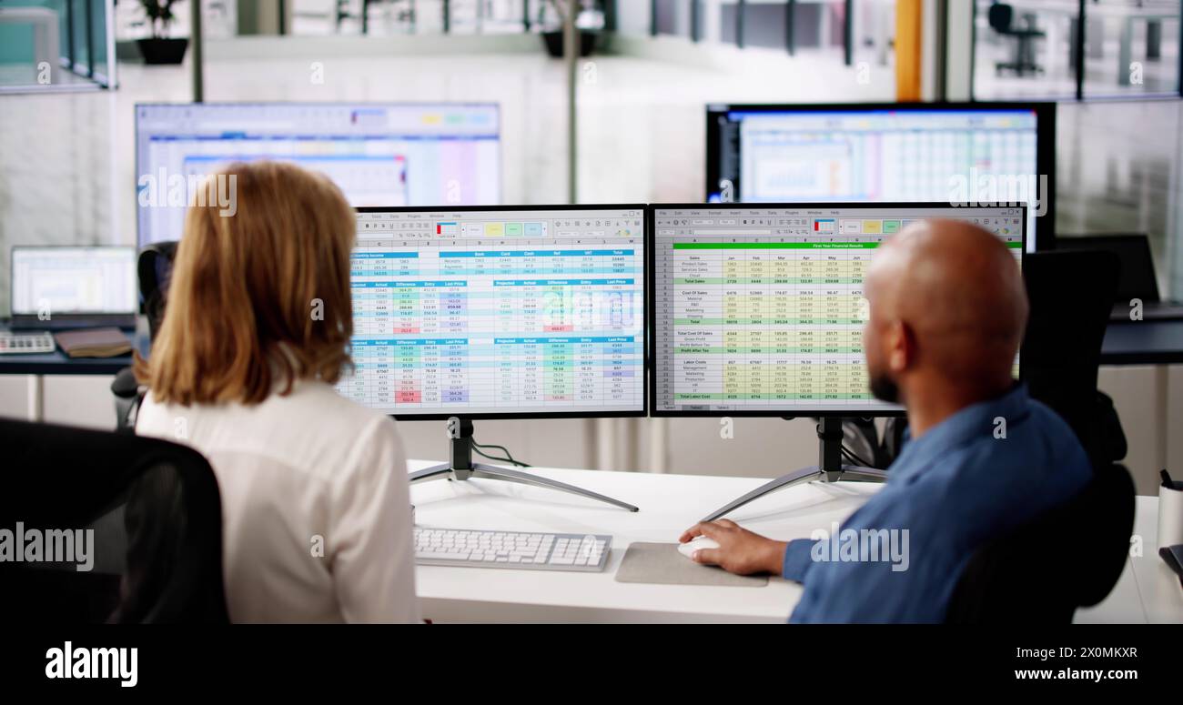 Analyst Employee Working On Spreadsheet Using Desktop Computer Stock ...