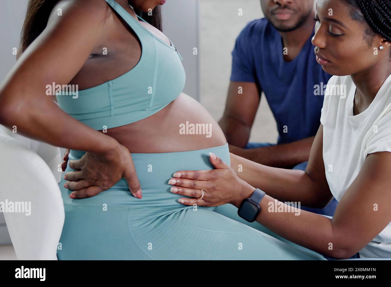 Black American Doula Providing Birth Care Treatment Stock Photo - Alamy