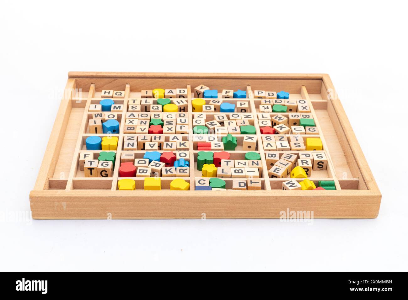 Small wooden cubes with alphabets in a box isolated on white background ...