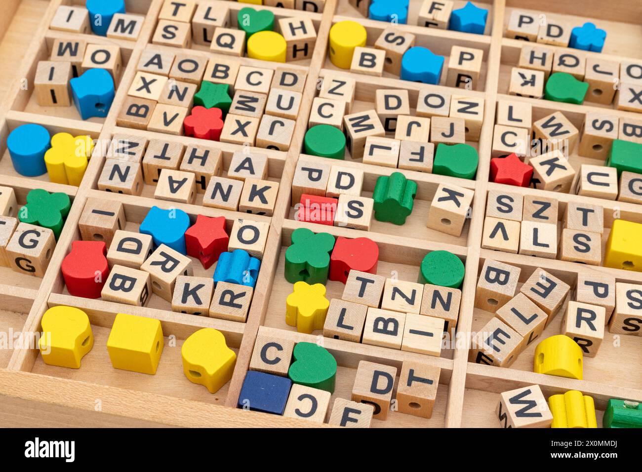 Wooden alphabets blocks games for learning in a box Stock Photo - Alamy