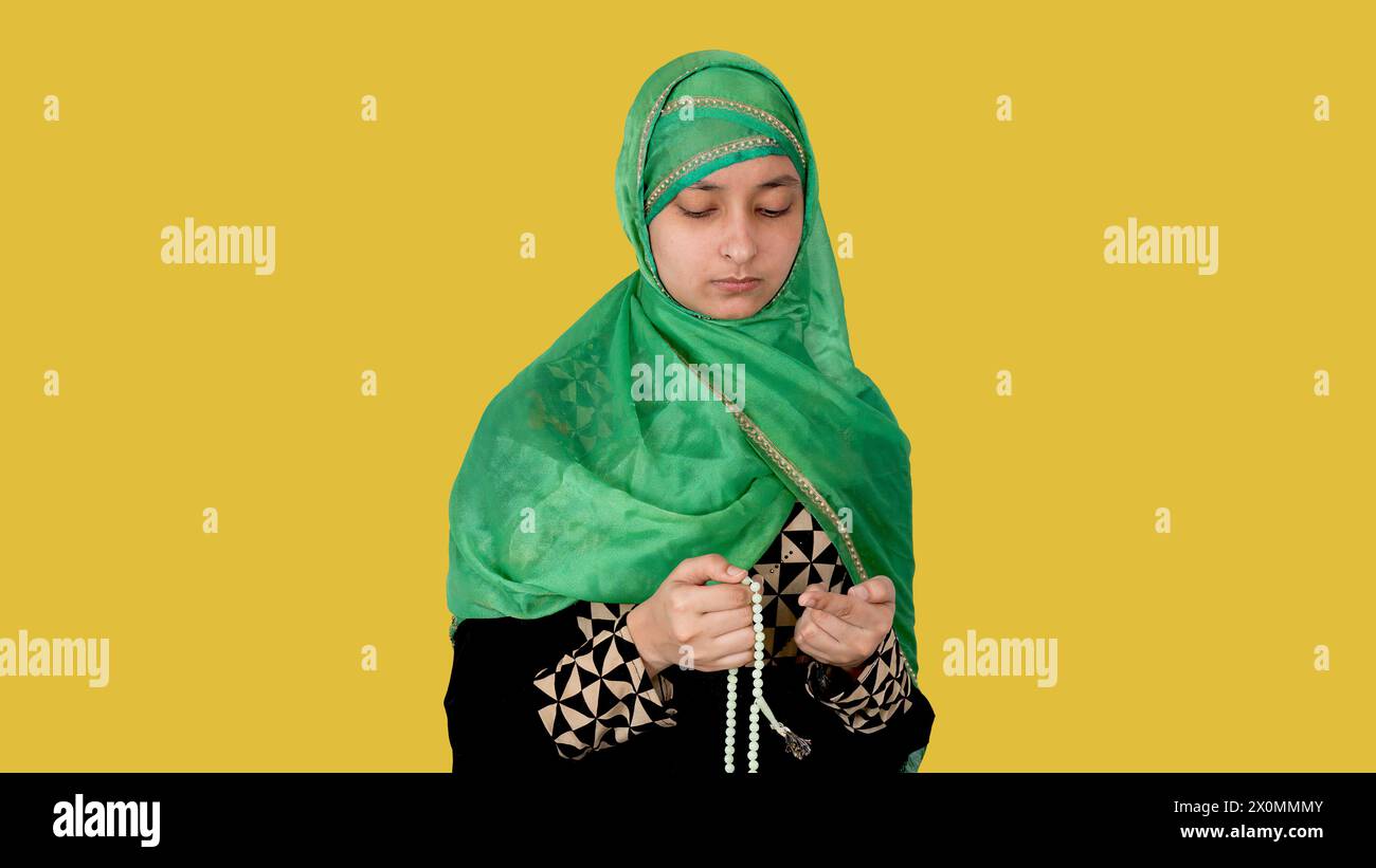 Beautiful Muslim Girl Reciting Tasbeeh with one Hand and Counting with ...