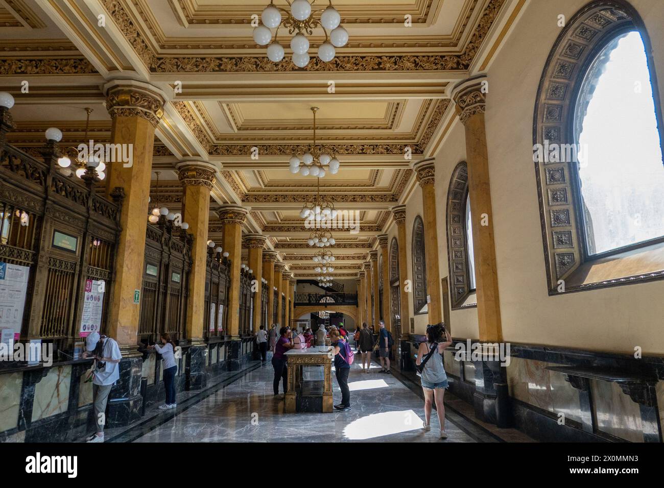 Visitors explore the architectural wonders of the historic post office ...