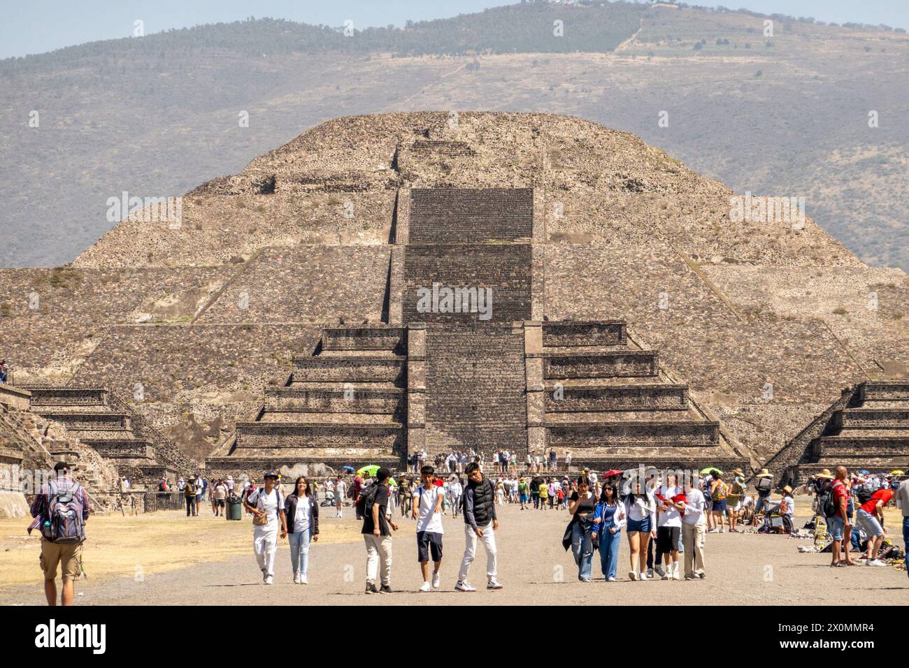 Tourists around The Pyramid of the Moon in Teotihuacán, a well ...